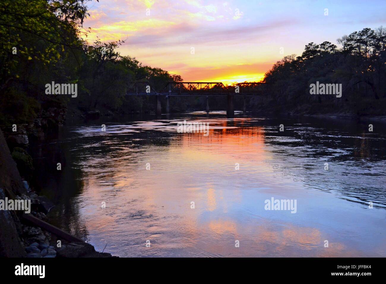 Railroad bridge over the Suwanee River at sunset Stock Photo - Alamy
