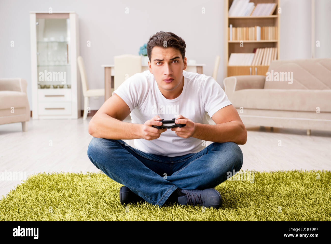 Man addicted to computer games Stock Photo - Alamy