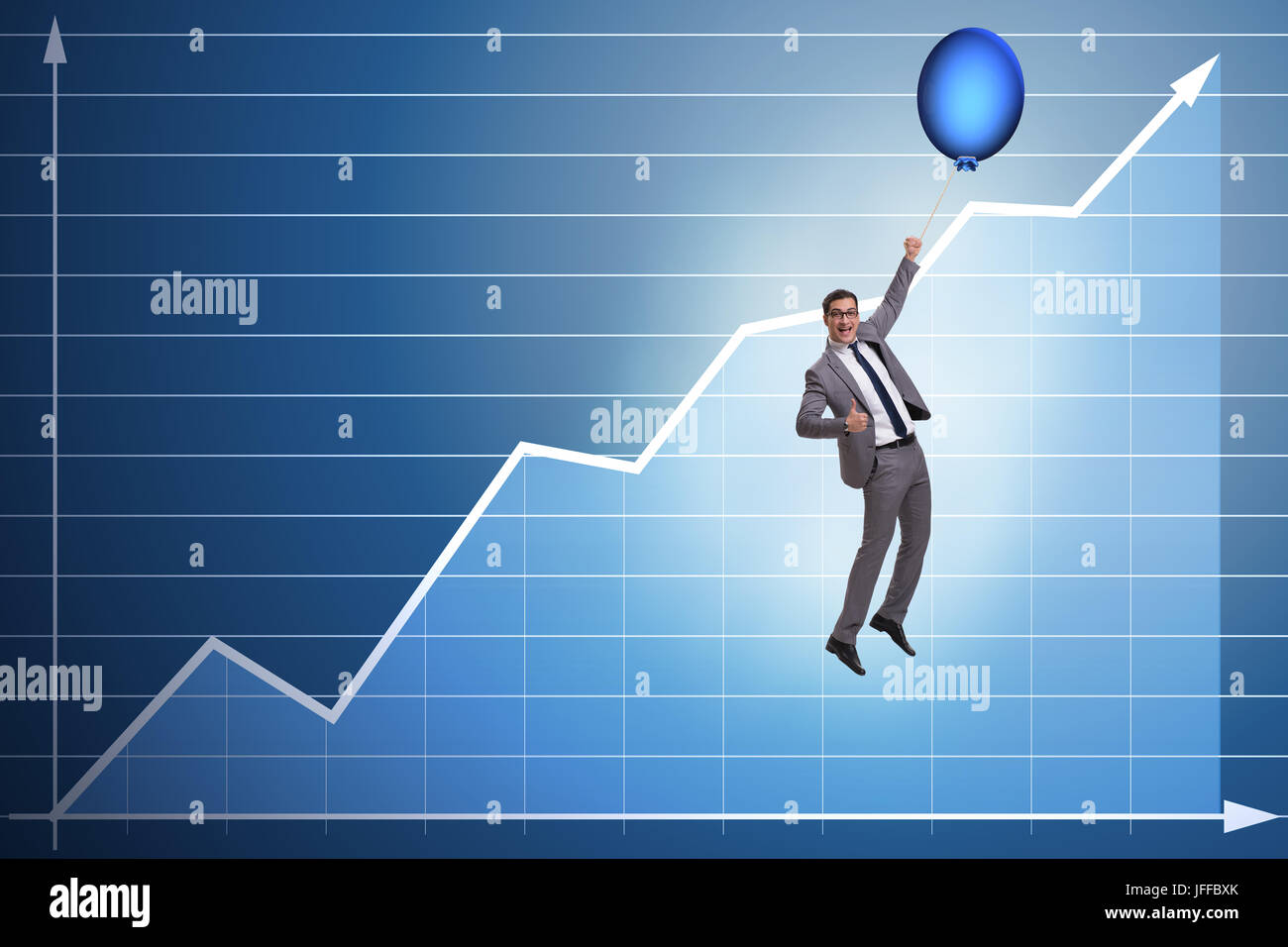 Businessman flying on hot balloon over graph Stock Photo - Alamy