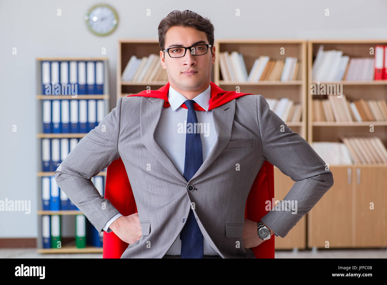 Superhero businessman working in the office Stock Photo - Alamy