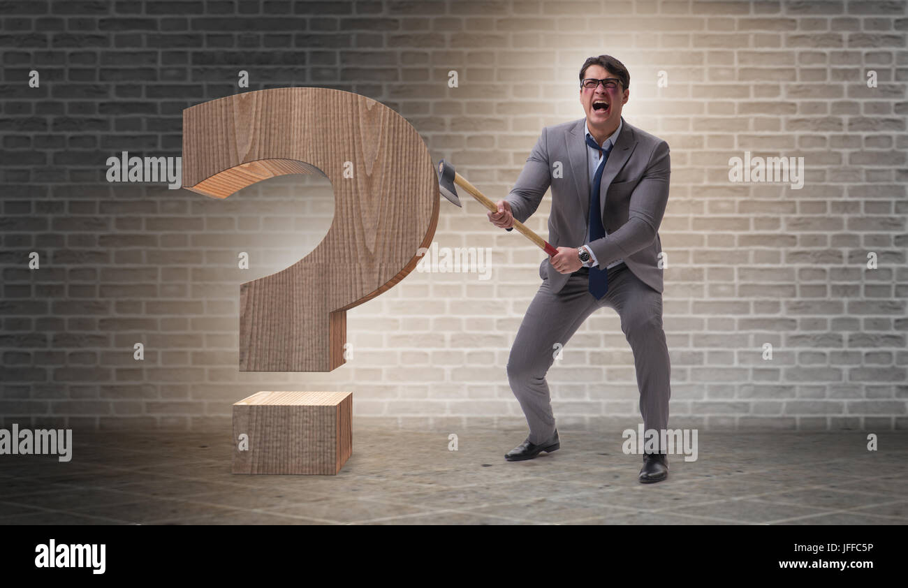 Angry man with axe axing the question mark Stock Photo - Alamy
