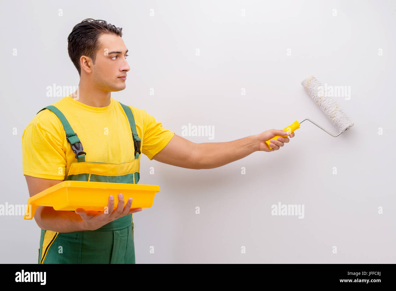 Man painting the wall in DIY concept Stock Photo - Alamy