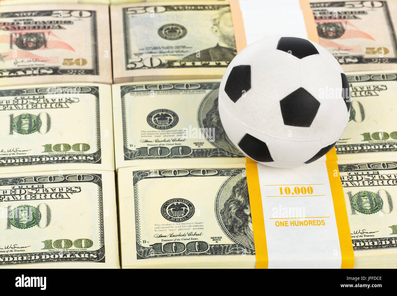 Money and soccer ball Stock Photo - Alamy