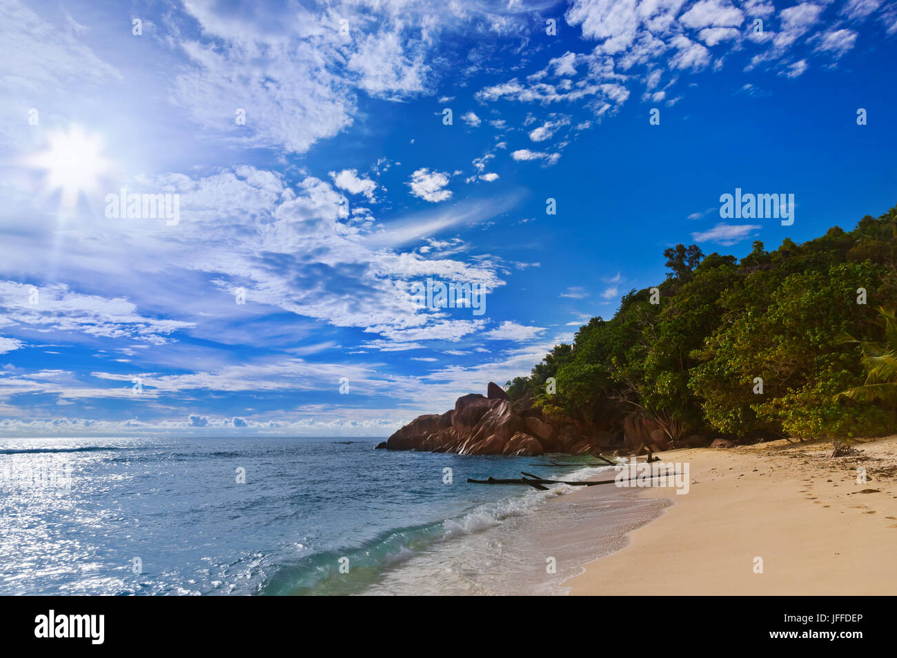 Seychelles tropical beach at sunset Stock Photo - Alamy