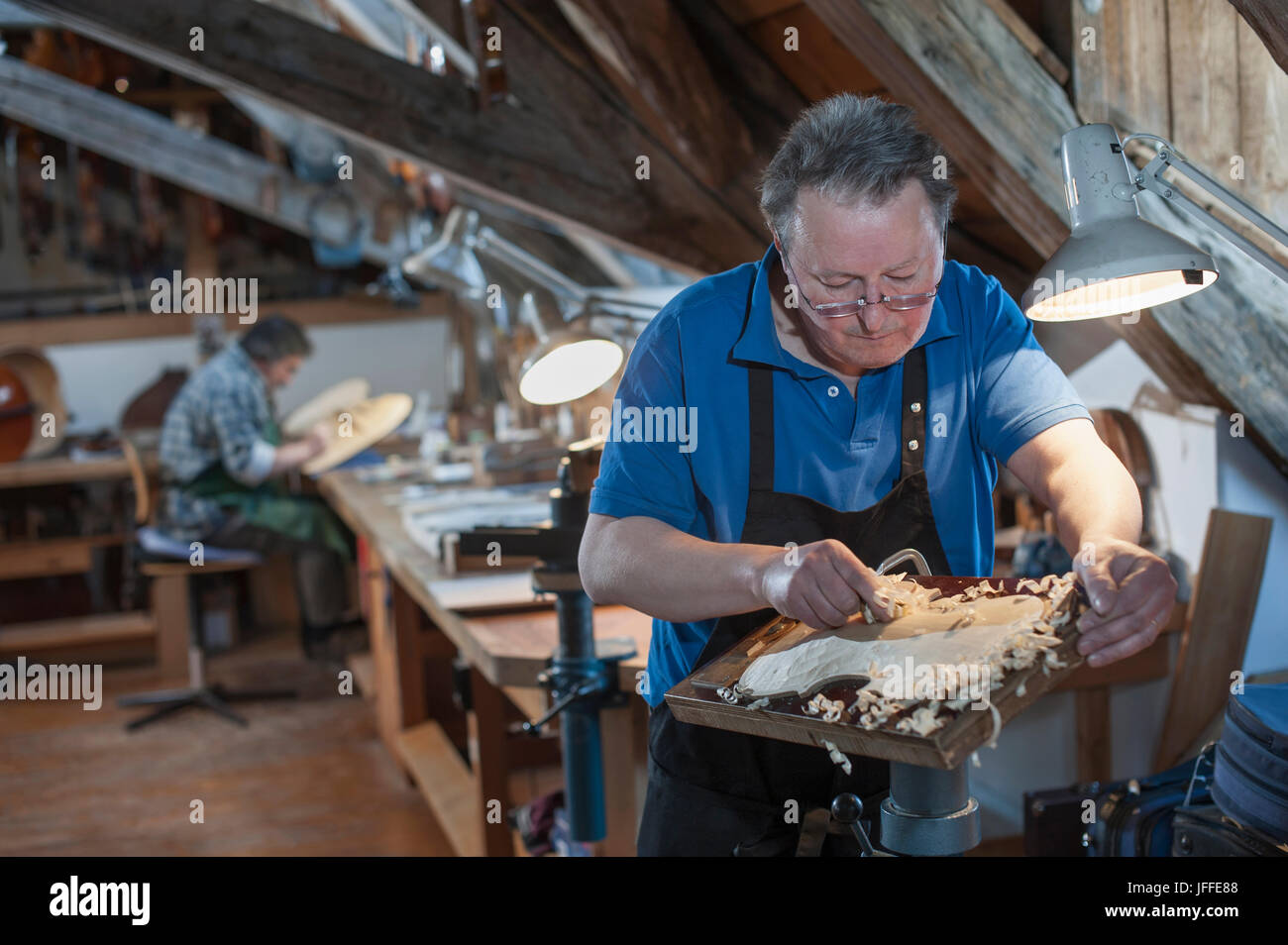 Craftsmen working at workshop Stock Photo - Alamy
