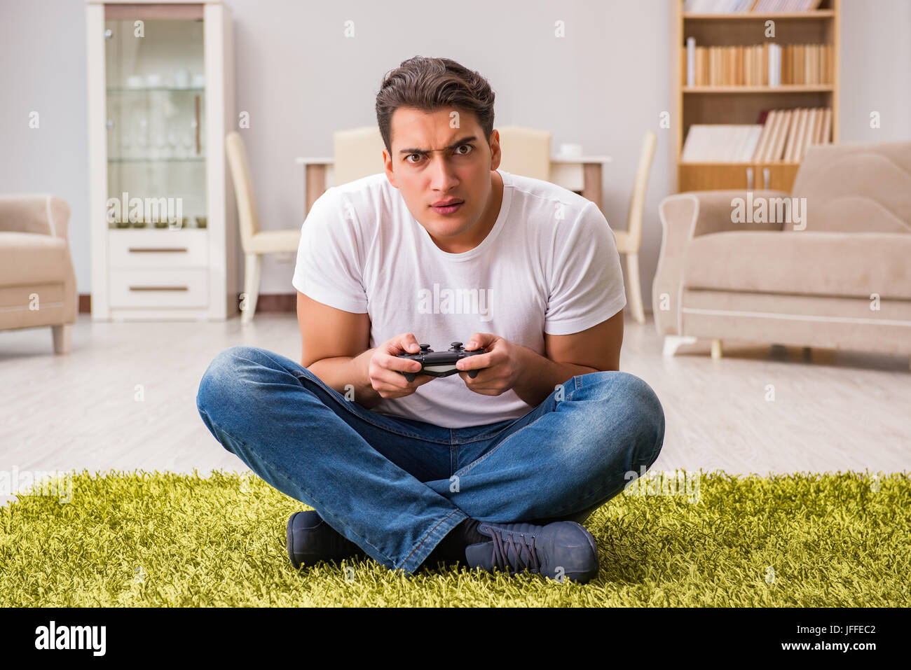 Man addicted to computer games Stock Photo - Alamy
