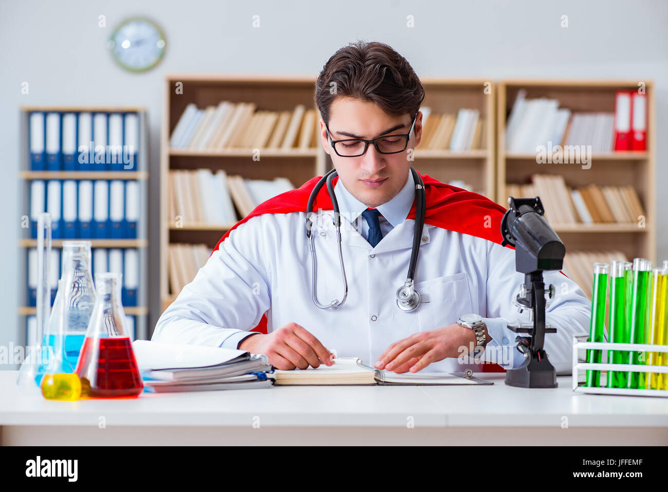 Superhero doctor working in the hospital lab Stock Photo - Alamy