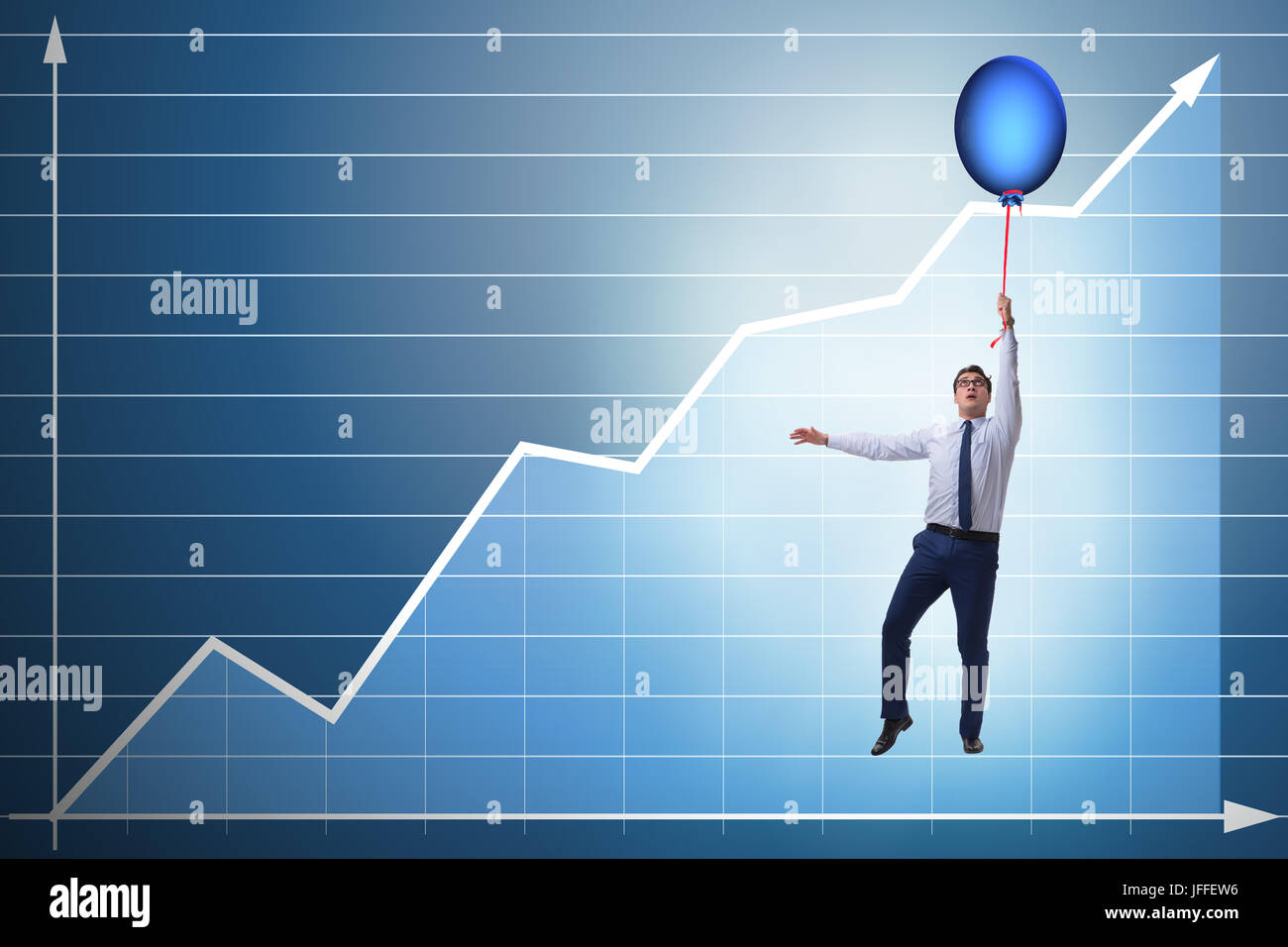 Businessman flying on hot balloon over graph Stock Photo - Alamy