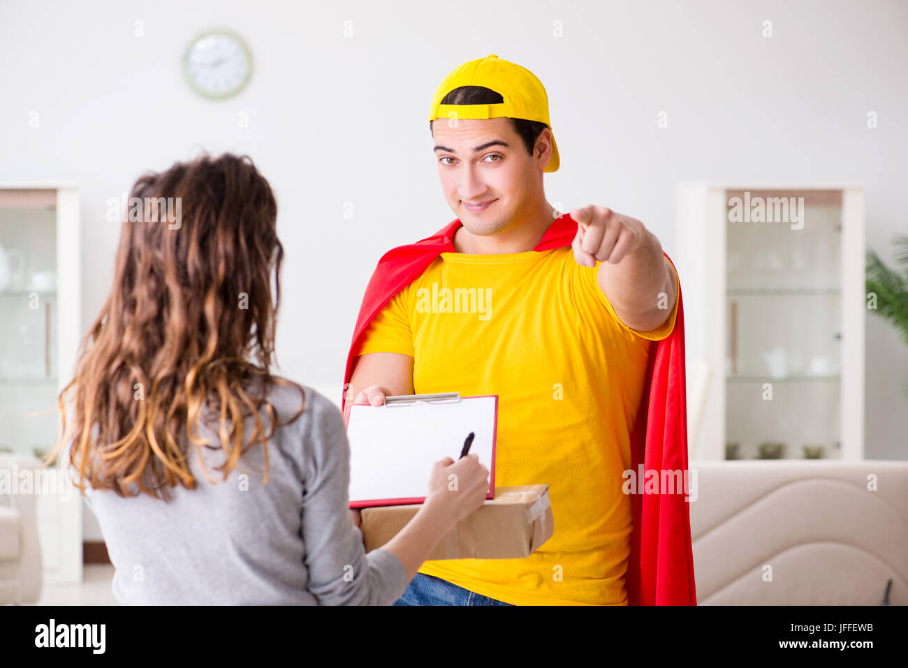 Superhero delivery guy with box Stock Photo - Alamy