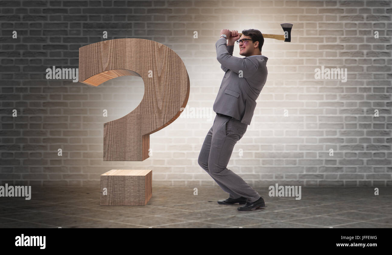 Angry man with axe axing the question mark Stock Photo - Alamy