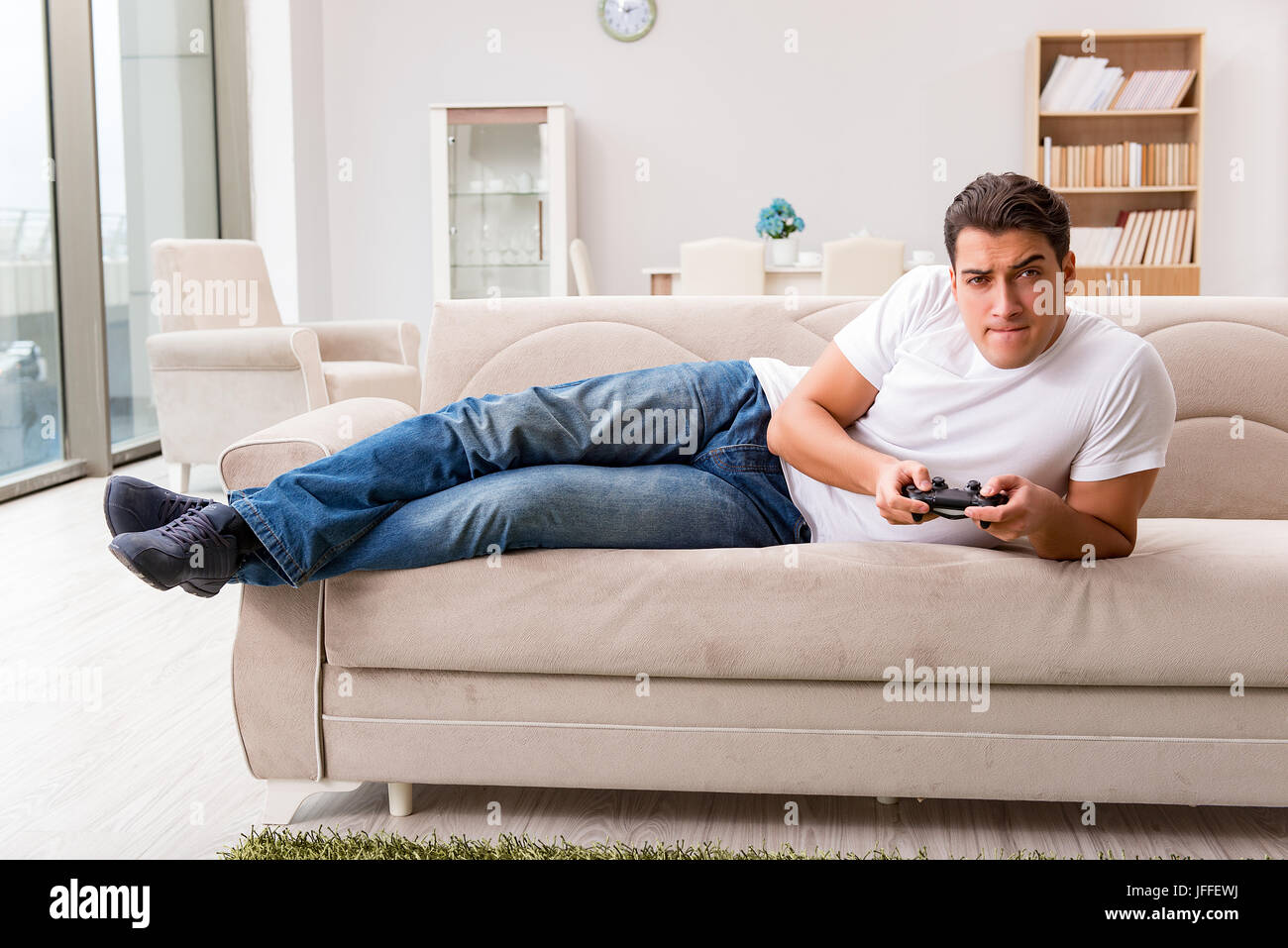 Man addicted to computer games Stock Photo - Alamy