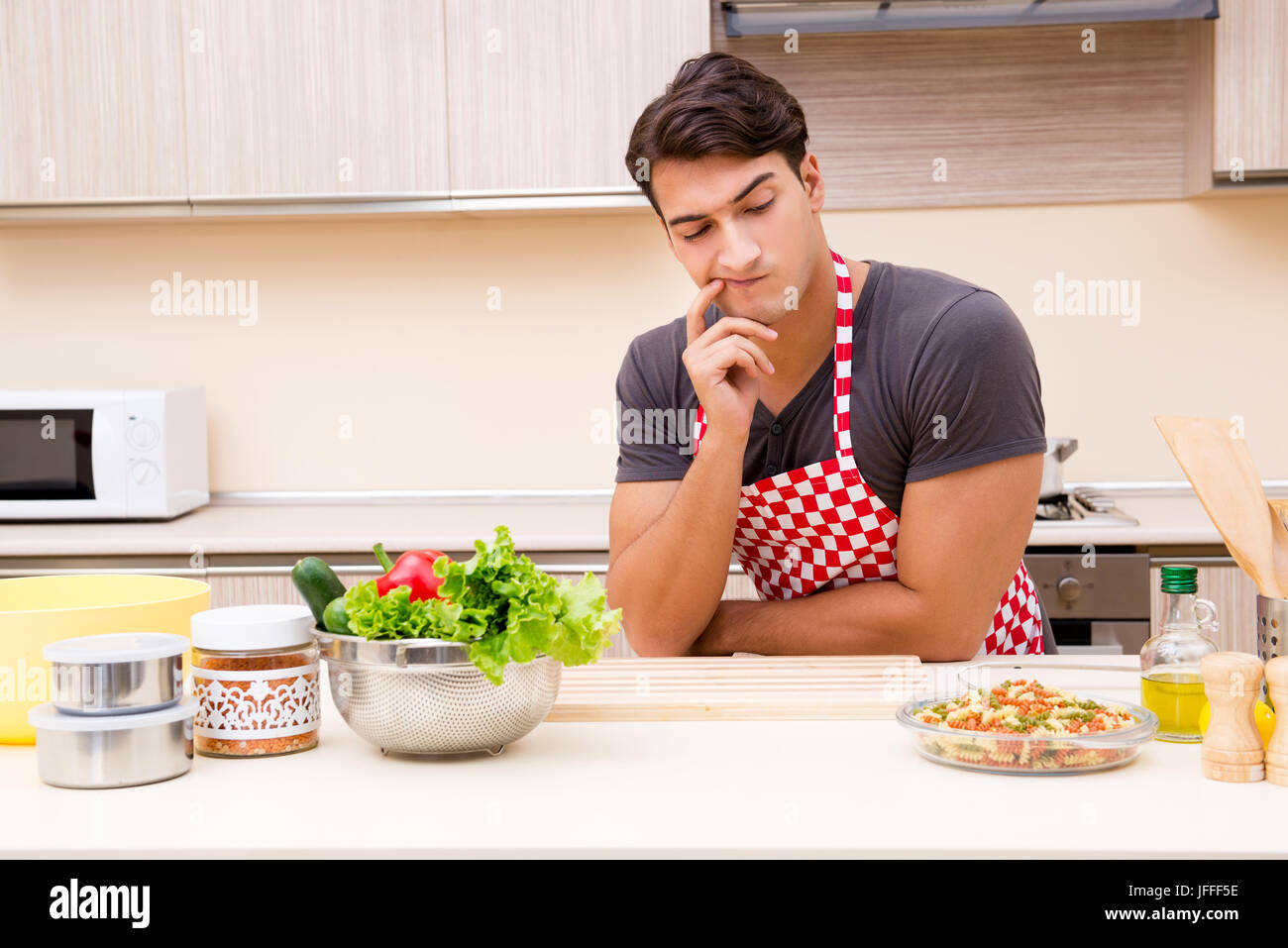 Man male cook preparing food in kitchen Stock Photo - Alamy