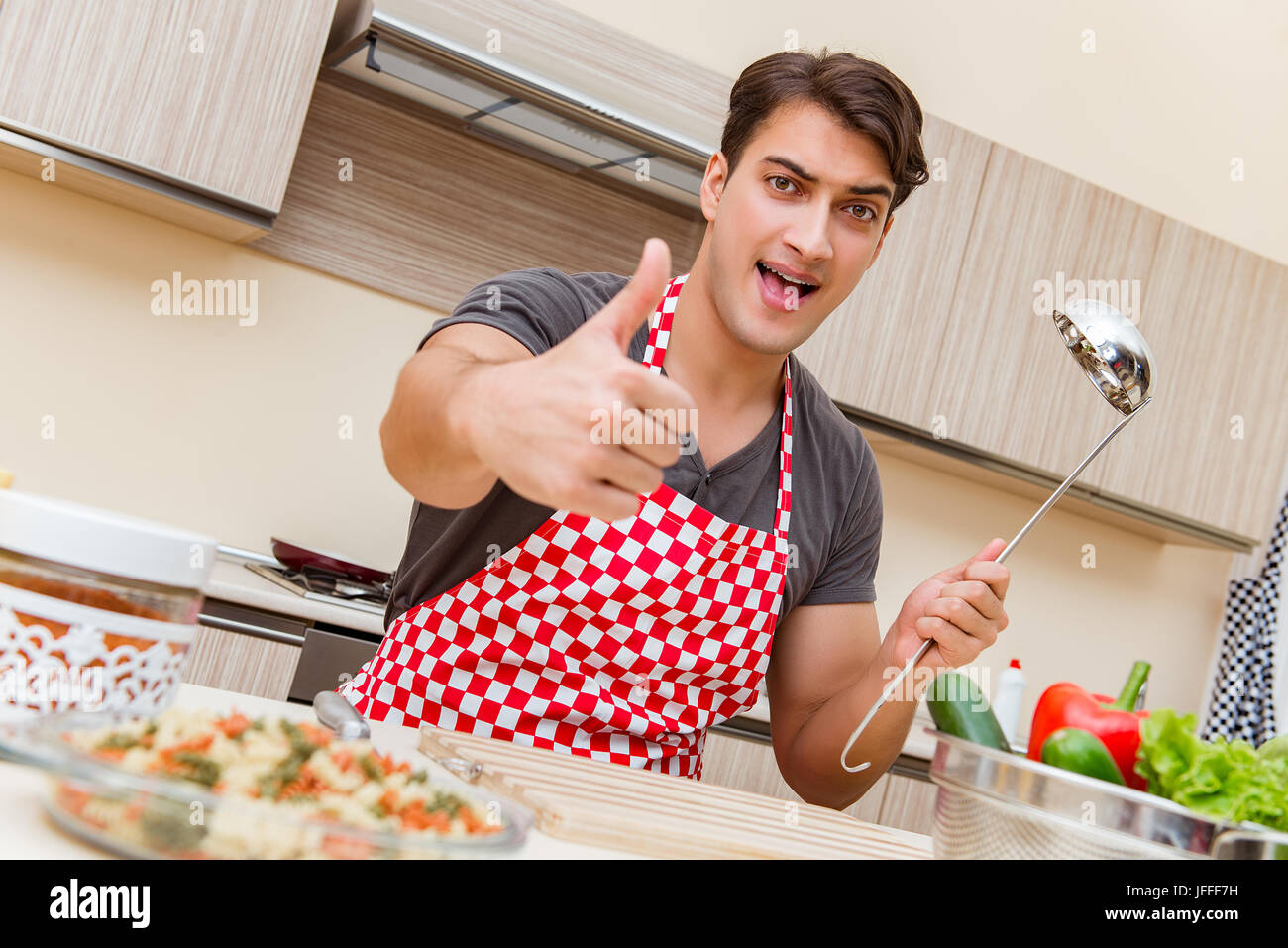 Man male cook preparing food in kitchen Stock Photo - Alamy