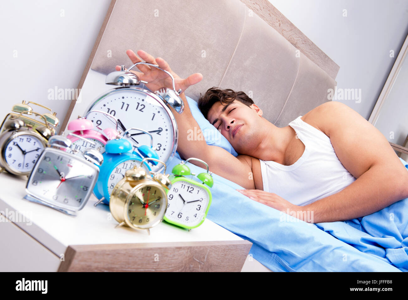 Man having trouble waking up in morning Stock Photo - Alamy