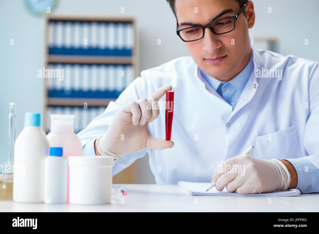 Doctor working with blood samples Stock Photo - Alamy