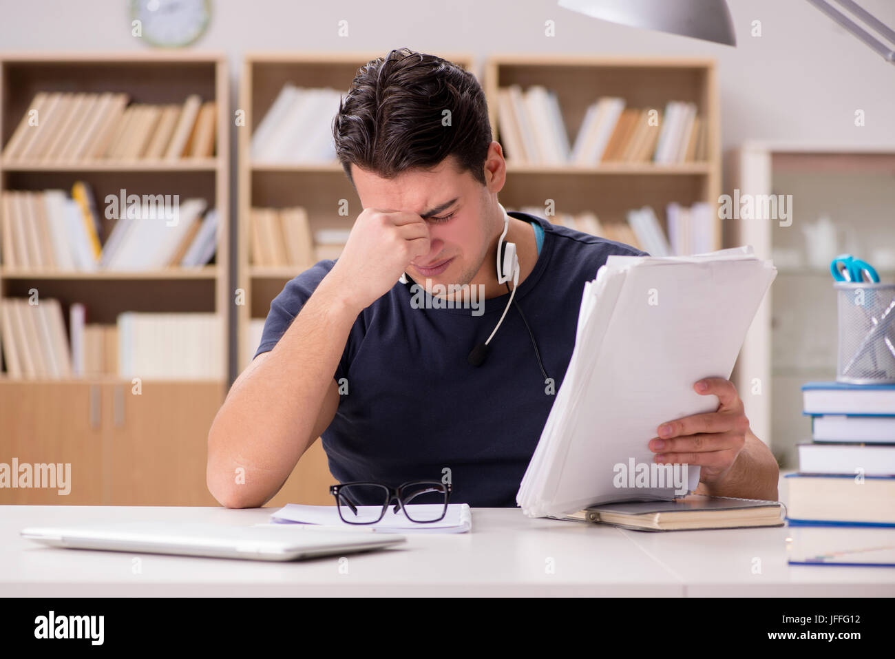 Unhappy teenager reading book hi-res stock photography and images - Alamy