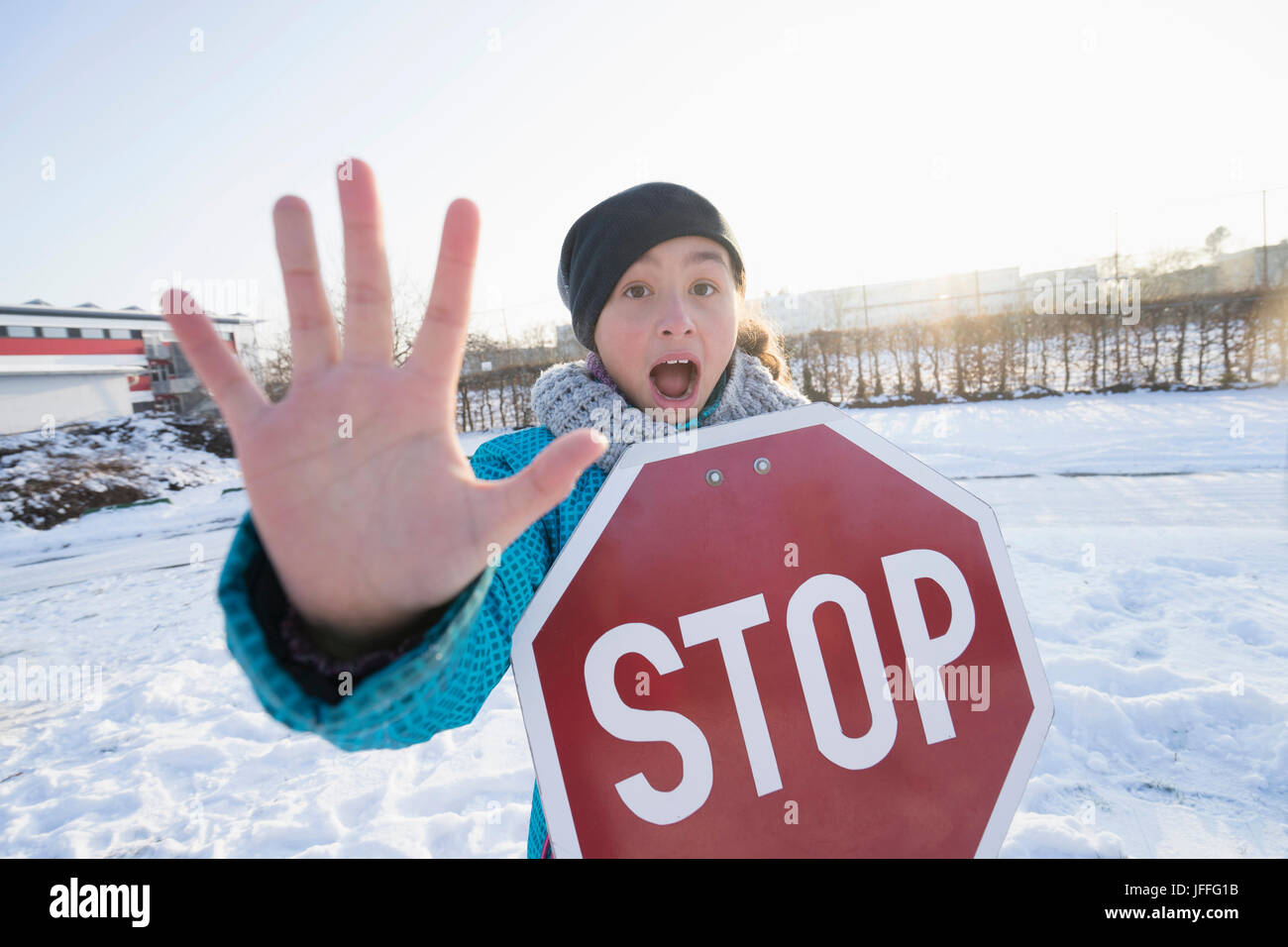 Portrait girl holding stop sign hi-res stock photography and images - Alamy