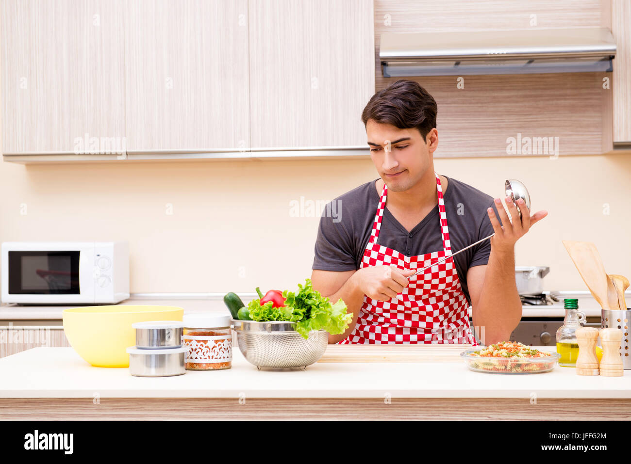 Man male cook preparing food in kitchen Stock Photo - Alamy