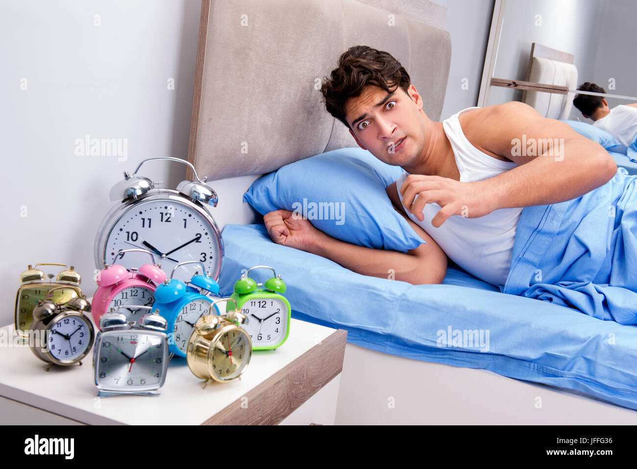 Man having trouble waking up in morning Stock Photo - Alamy