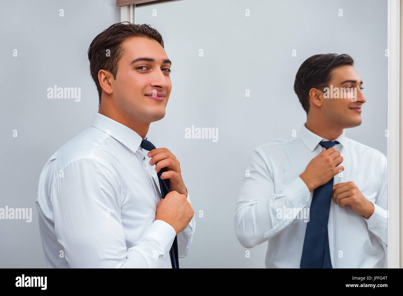 Businessman dressing up for work Stock Photo - Alamy