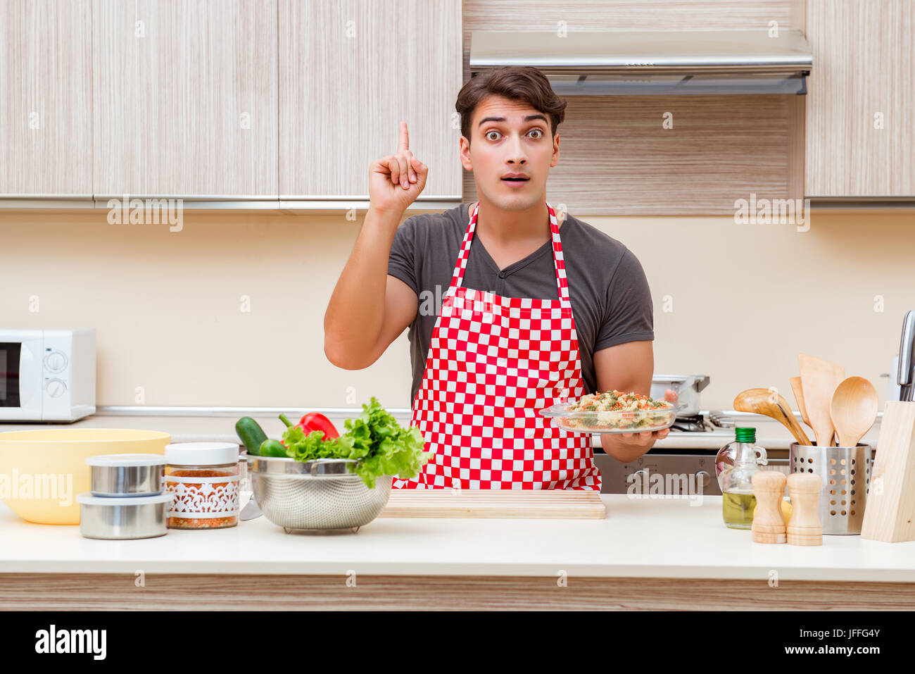 Man male cook preparing food in kitchen Stock Photo - Alamy