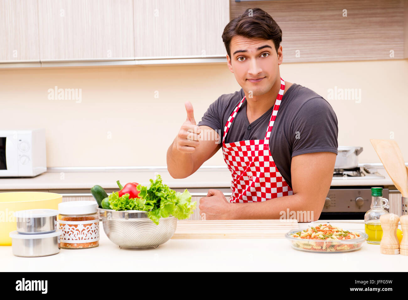 Man male cook preparing food in kitchen Stock Photo - Alamy
