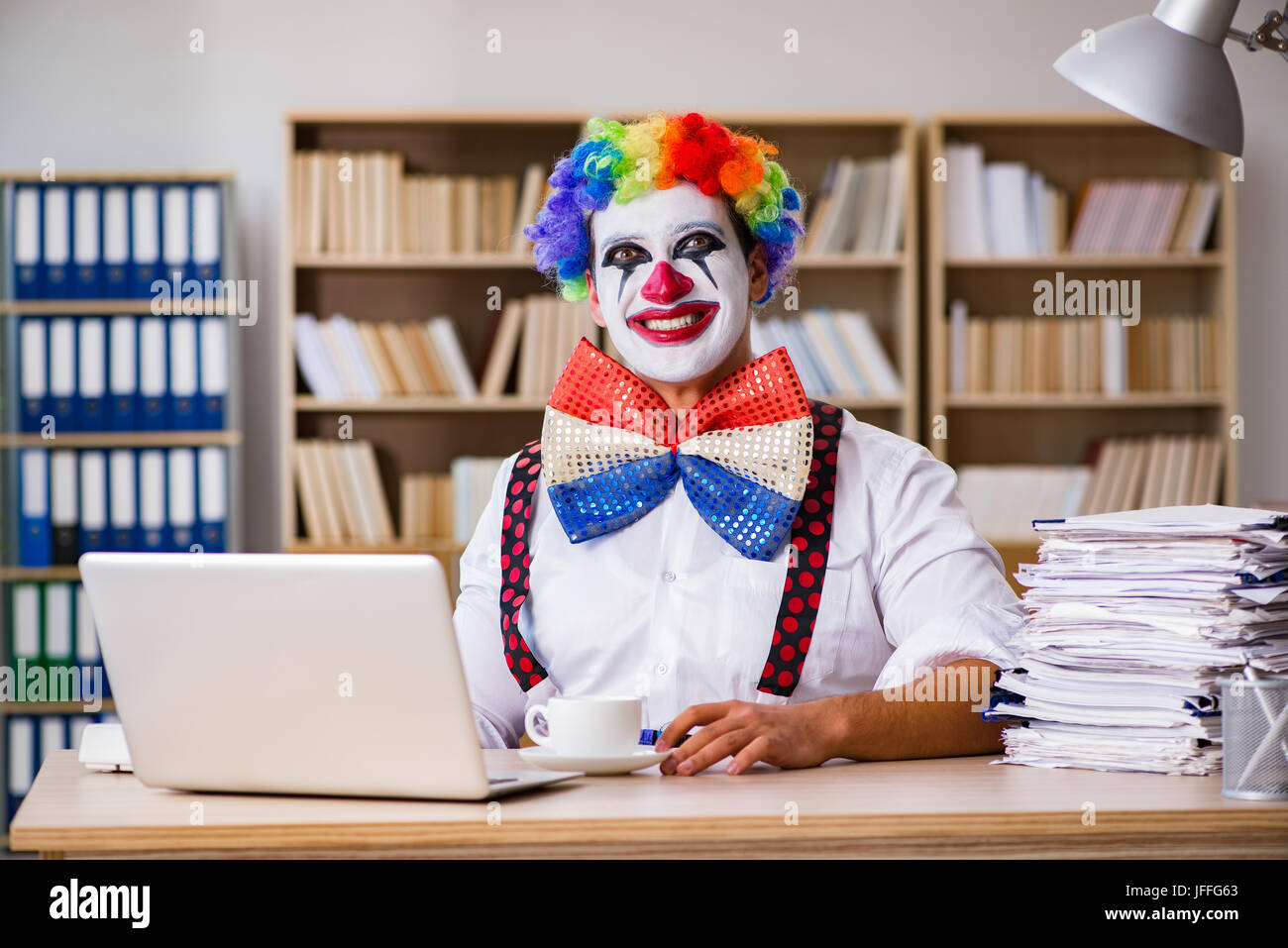 Clown businessman working in the office Stock Photo - Alamy