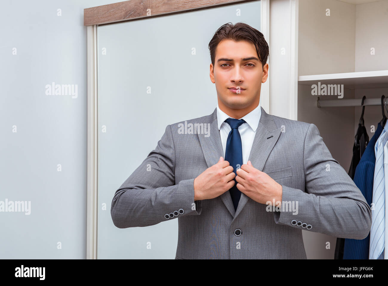 Businessman dressing up for work Stock Photo - Alamy