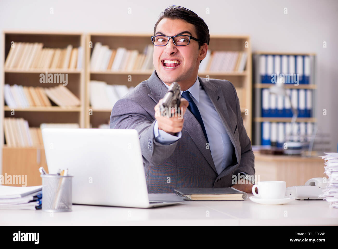 Angry businessman working in the office Stock Photo - Alamy