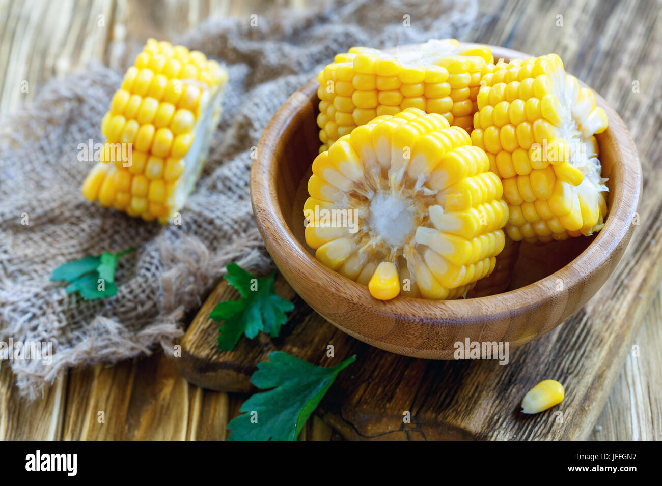 Corn cob cut in a wooden bowl close-up Stock Photo - Alamy