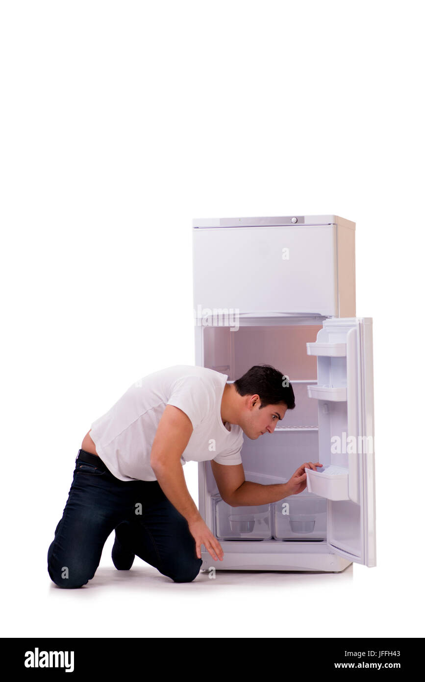 Man looking for food in empty fridge Stock Photo - Alamy