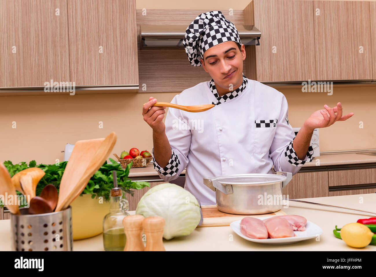 Young chef working in the kitchen Stock Photo - Alamy