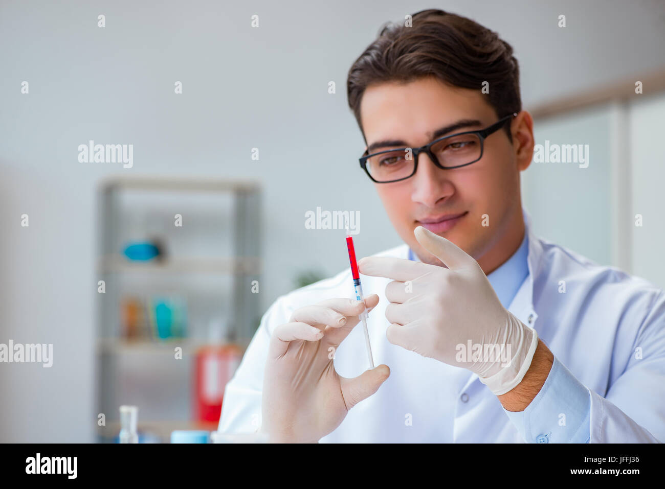 Doctor working with blood samples Stock Photo - Alamy
