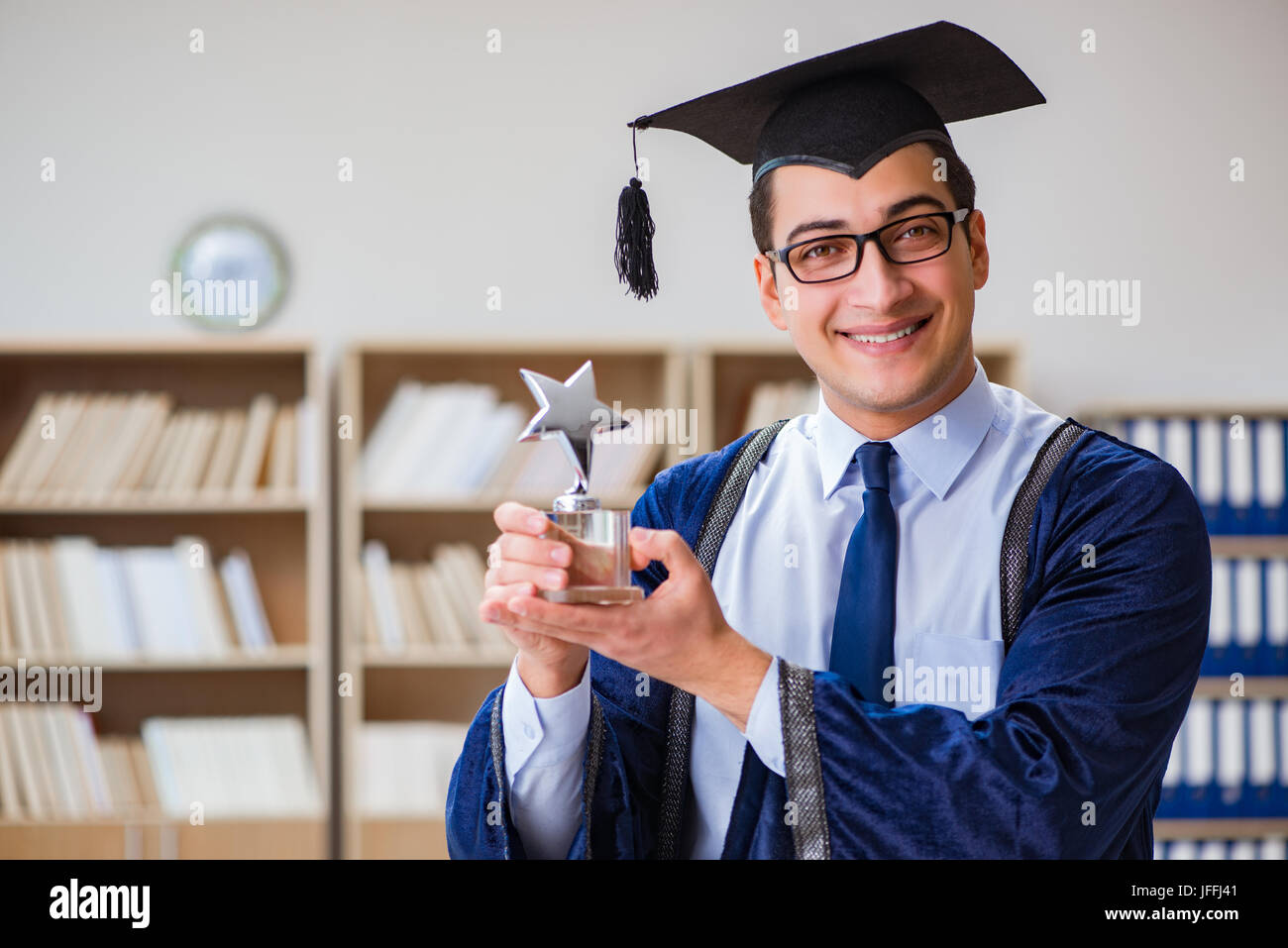 Young man graduating from university Stock Photo - Alamy