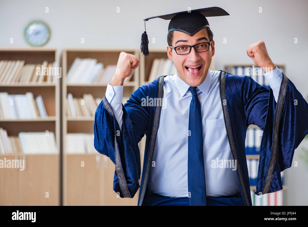Young man graduating from university Stock Photo - Alamy