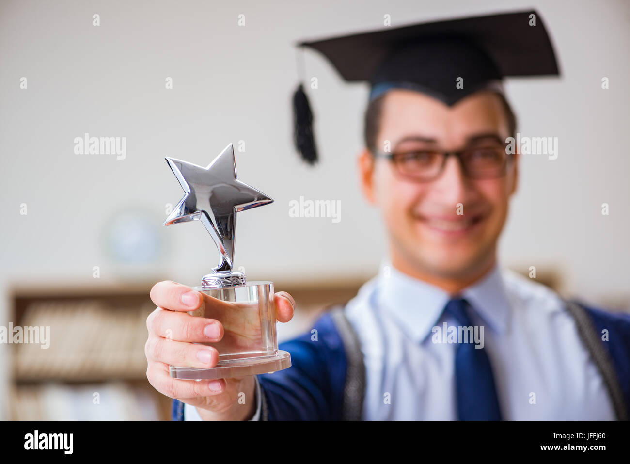 Young man graduating from university Stock Photo - Alamy