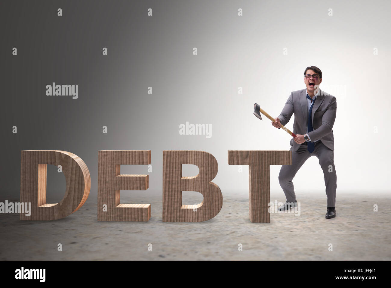 Angry man with axe axing the word debt Stock Photo - Alamy