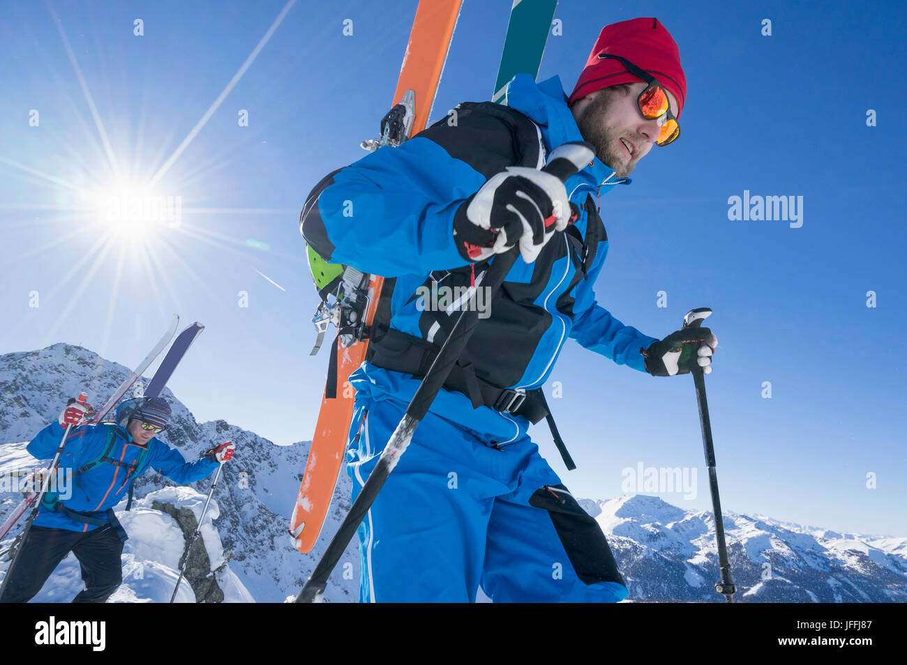 Skiers walking on snow hi-res stock photography and images - Alamy