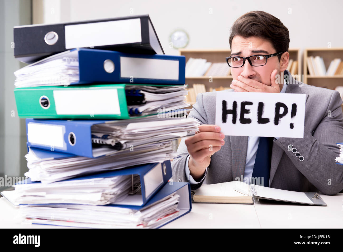 Busy businessman asking for help with work Stock Photo - Alamy