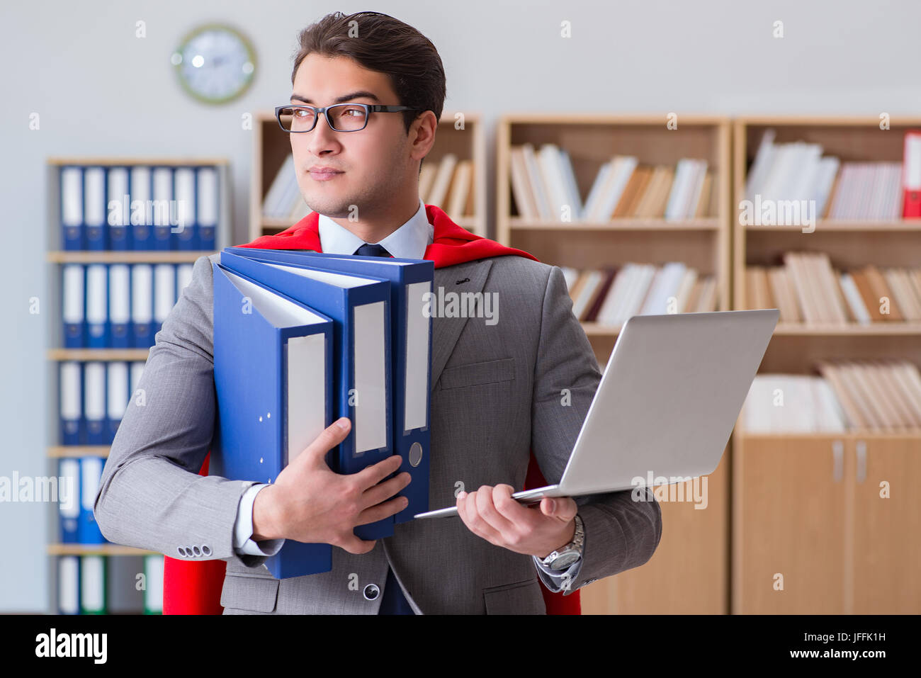 Superhero businessman working in the office Stock Photo - Alamy