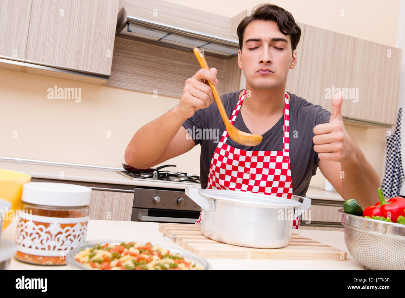 Man male cook preparing food in kitchen Stock Photo - Alamy