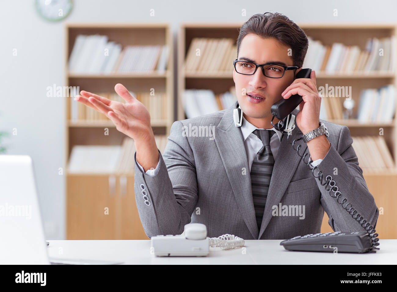 Call center operator talking on the phone Stock Photo - Alamy