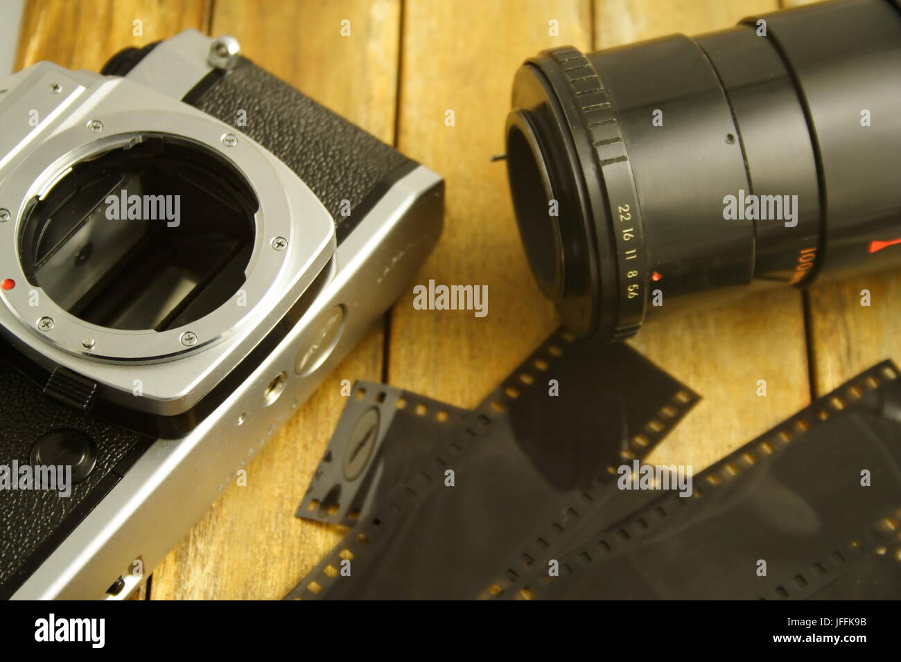 Film Camera with zoom lens and negatives Stock Photo - Alamy
