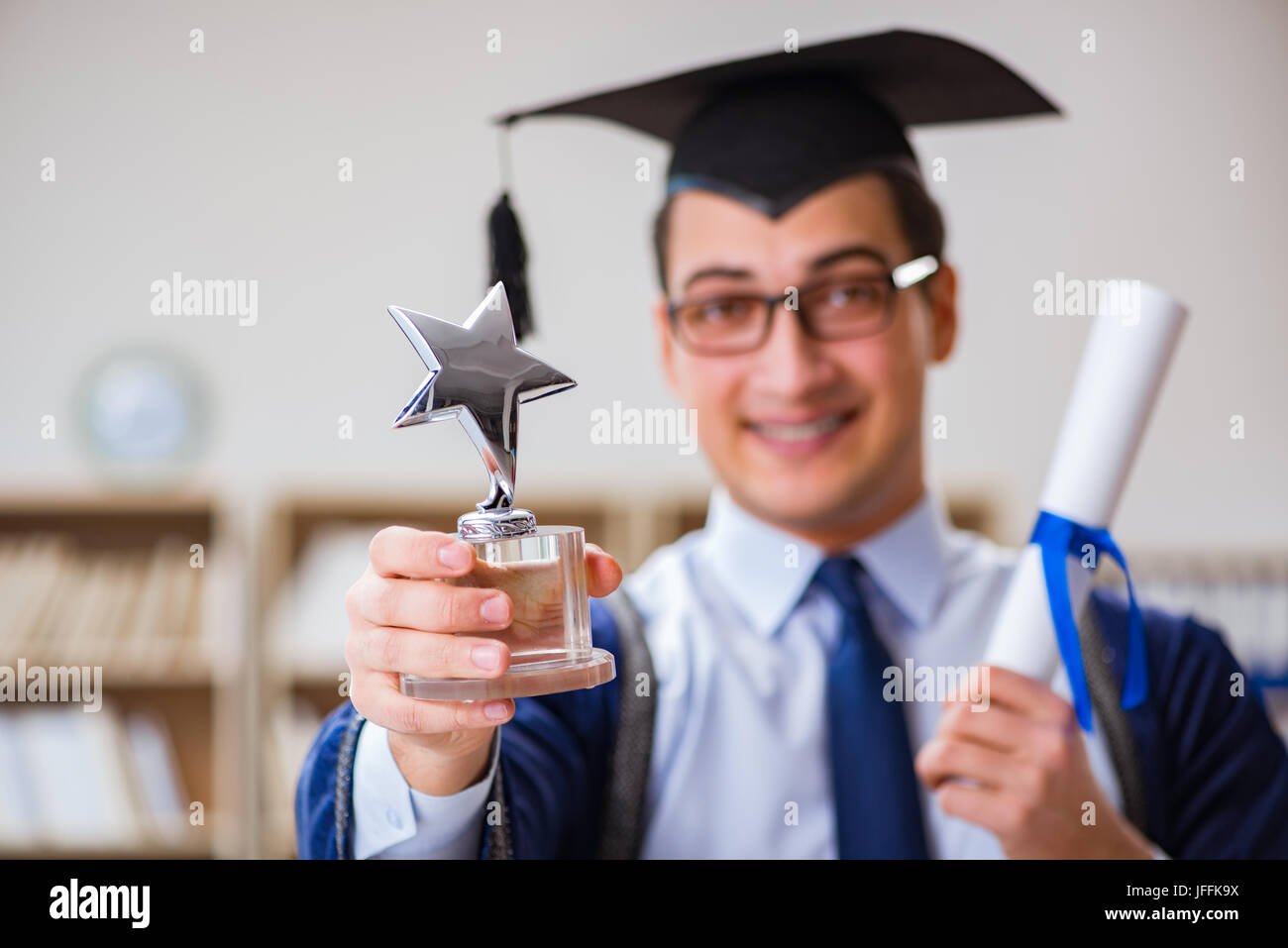 Young man graduating from university Stock Photo - Alamy