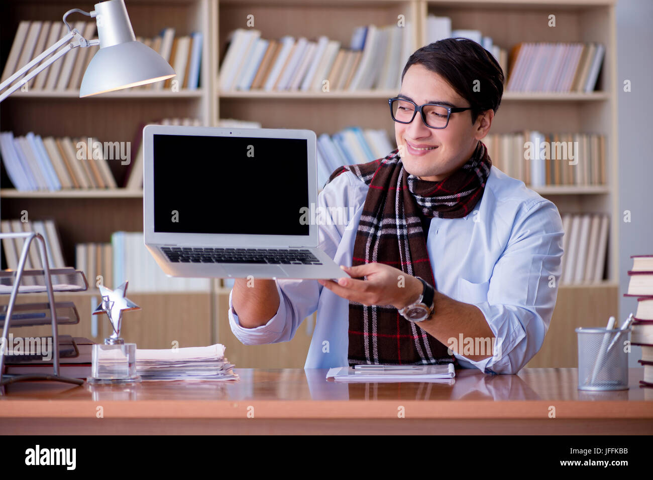 Young writer working in the library Stock Photo - Alamy