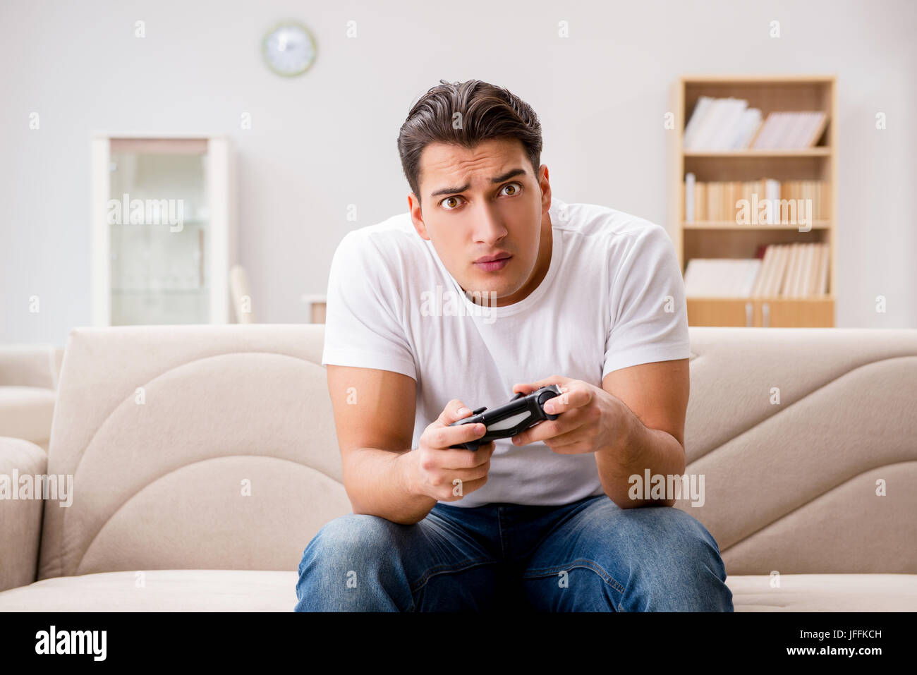 Man addicted to computer games Stock Photo - Alamy