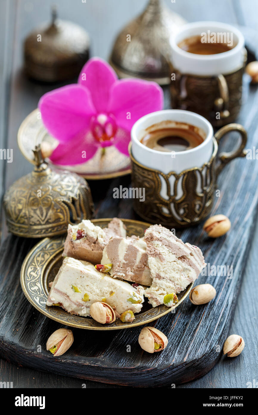Tahini halva with pistachios, and Turkish coffee Stock Photo - Alamy