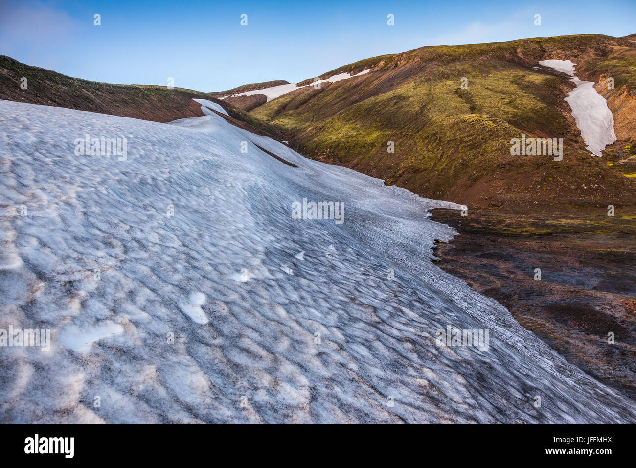 Big unmelted in July snowfield Stock Photo - Alamy