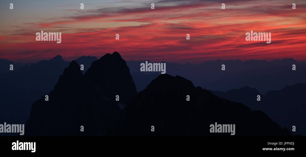 Red evening sky over the Swiss Alps Stock Photo - Alamy