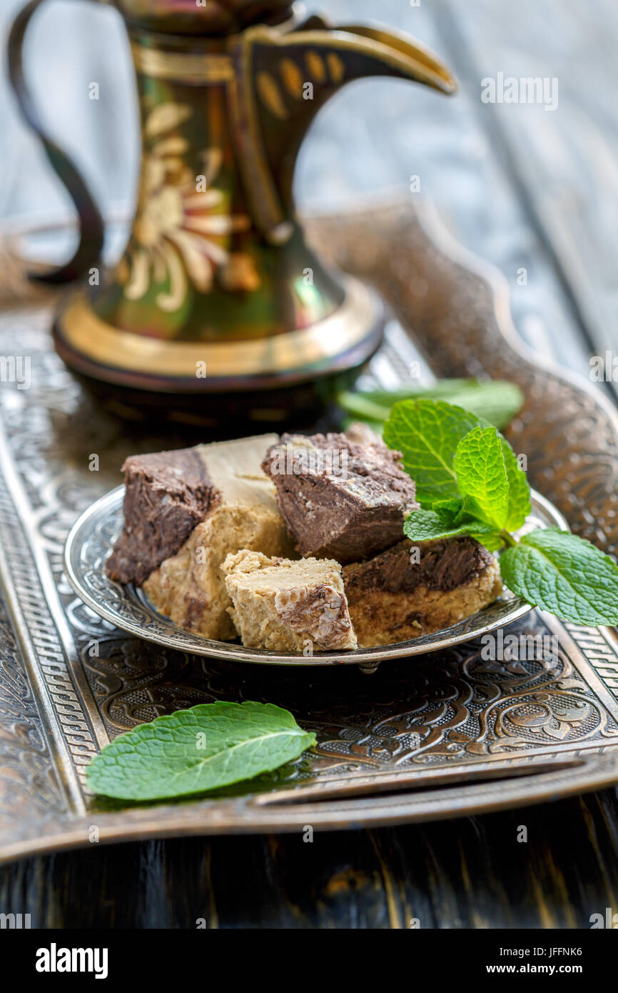 Plate with tahini halva with chocolate and jug Stock Photo - Alamy